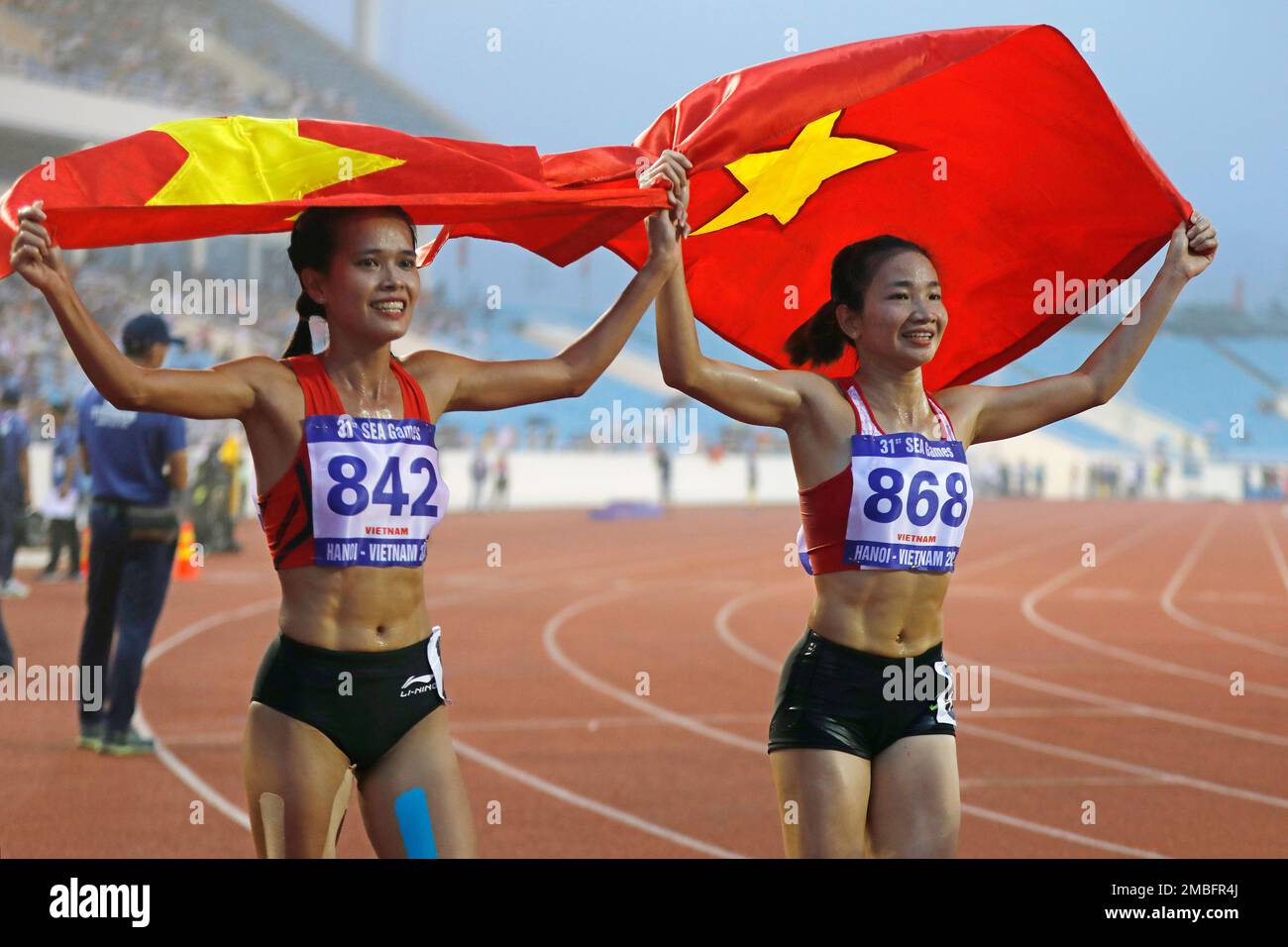 Gold medalist Nguyen Thi Oanh, right, and silver medalist Pham Thi Hong ...