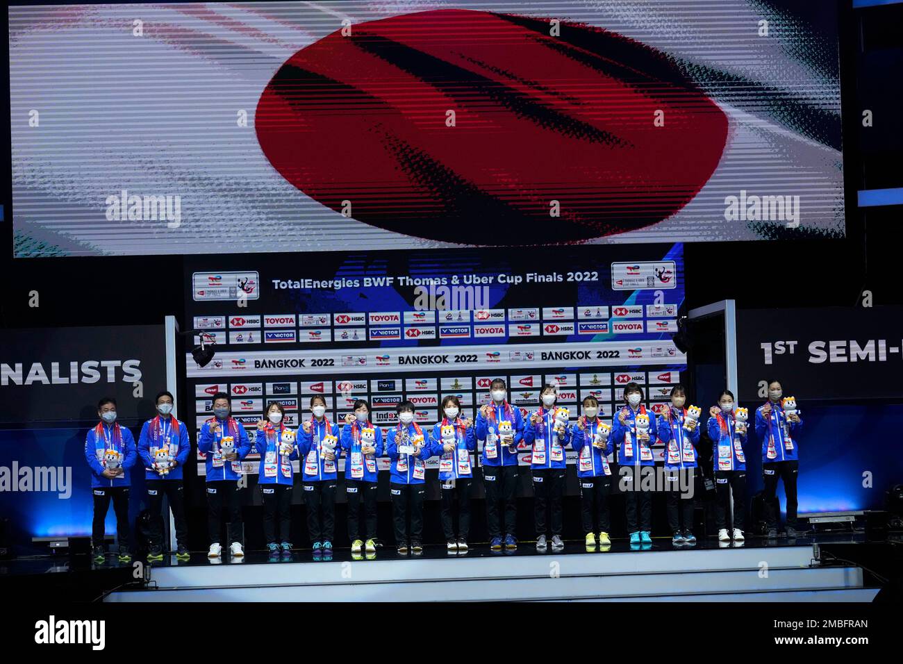 Japan's team members hold bronze medals during the awards ceremony ...