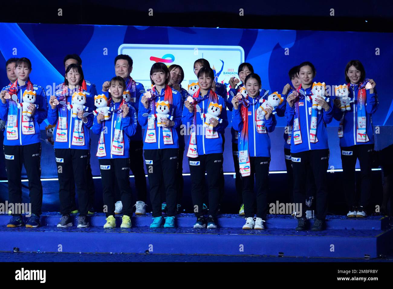 Japan's team members hold bronze medals during the awards ceremony ...