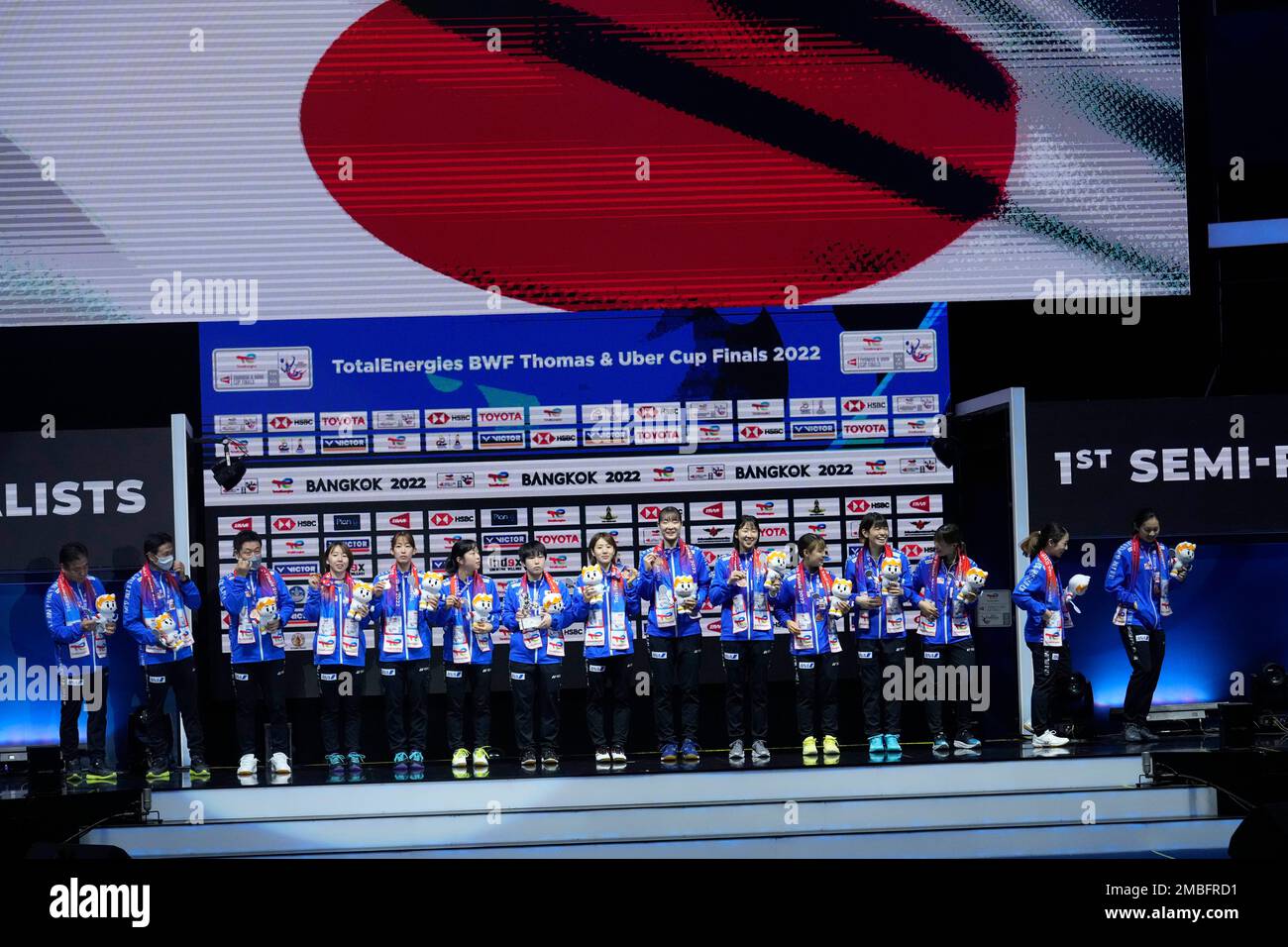 Japan's team members hold bronze medals during the awards ceremony ...