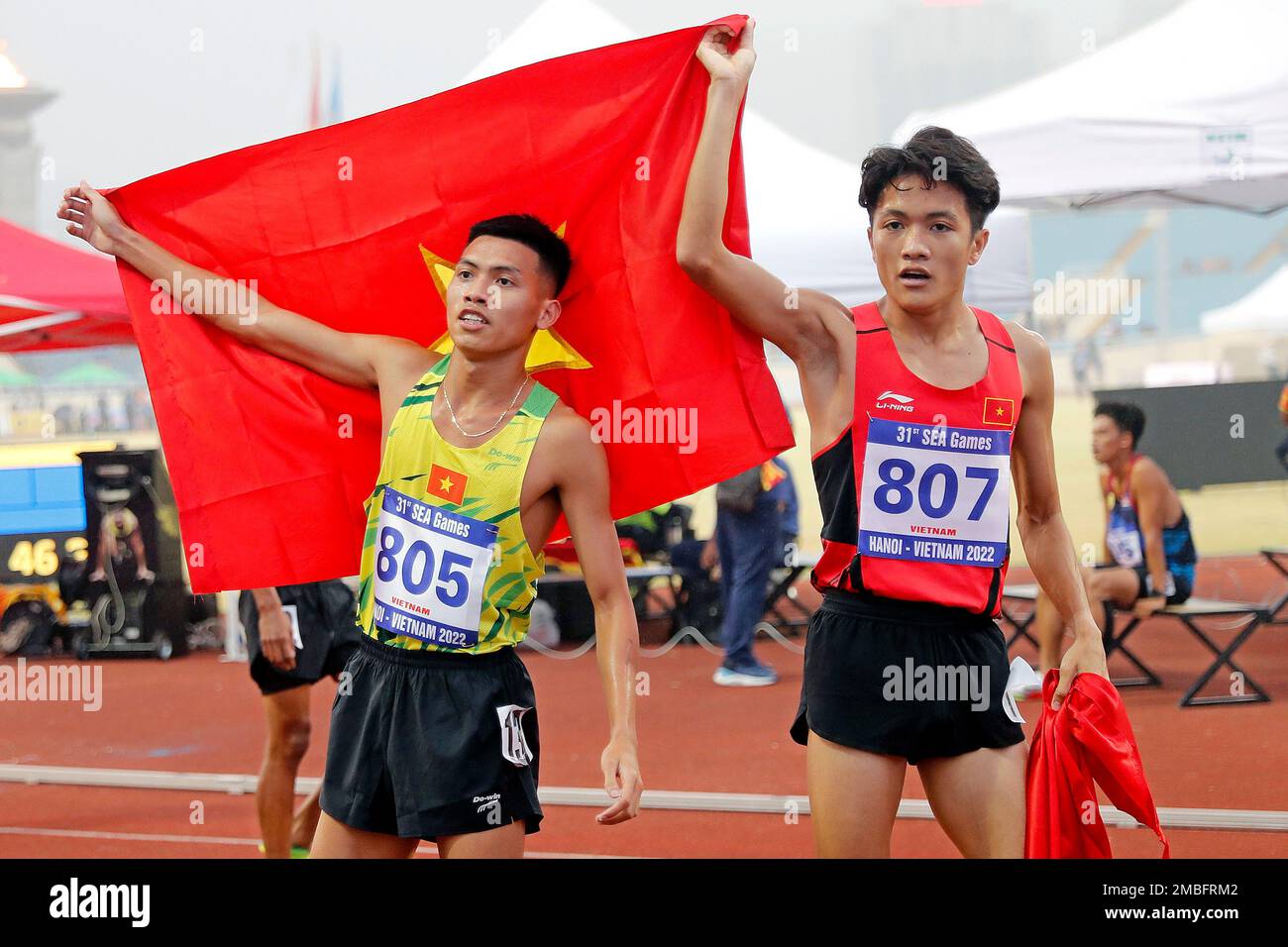 Gold medalist Luong Duc Phuoc, right, and silver medalist Tran Van Dang of Vietnam celebrate ...