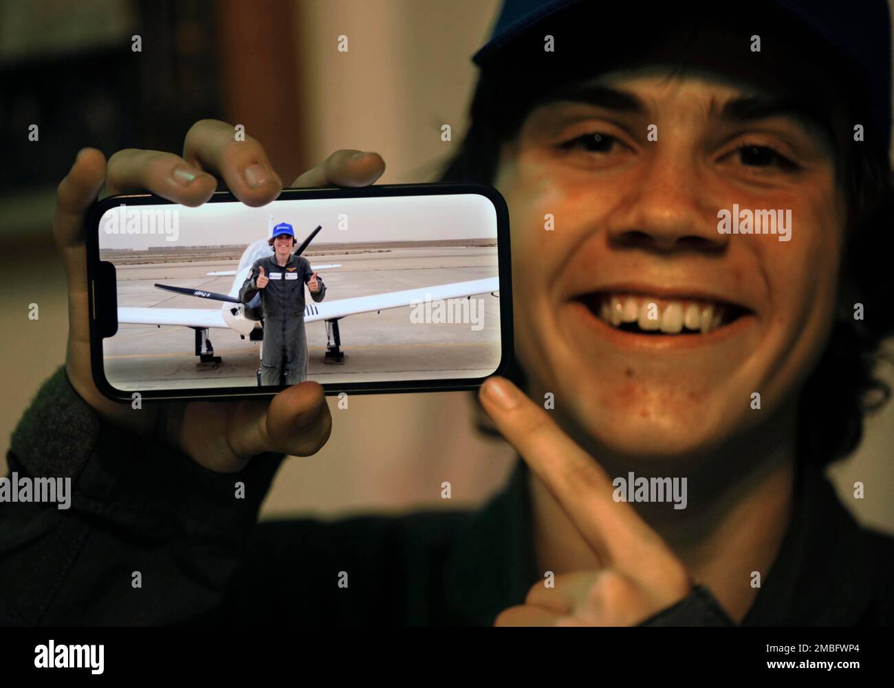 Belgian-British pilot Mack Rutherford, 16, displays a picture showing ...