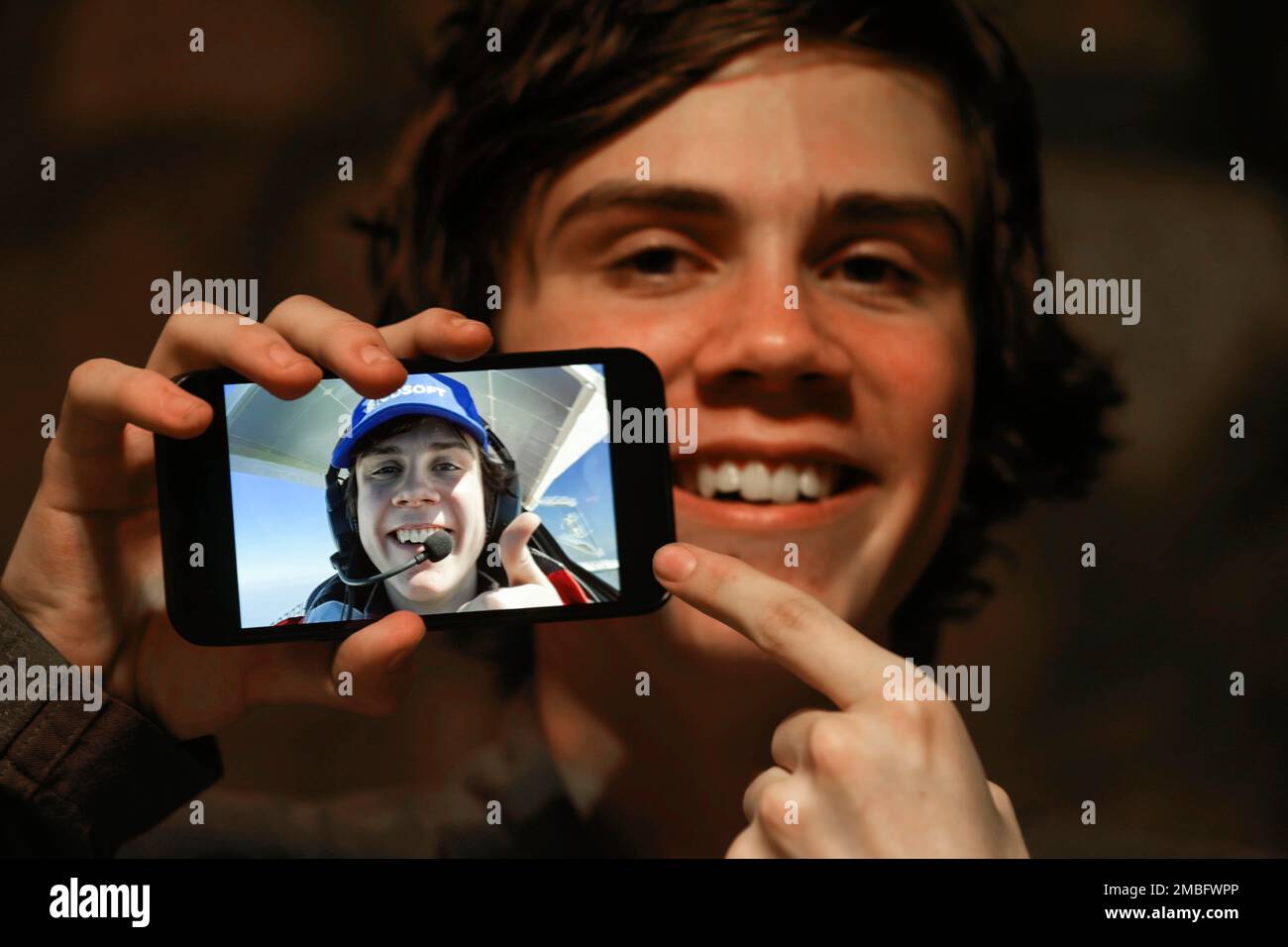 Belgian-British pilot Mack Rutherford, 16, displays a picture showing ...