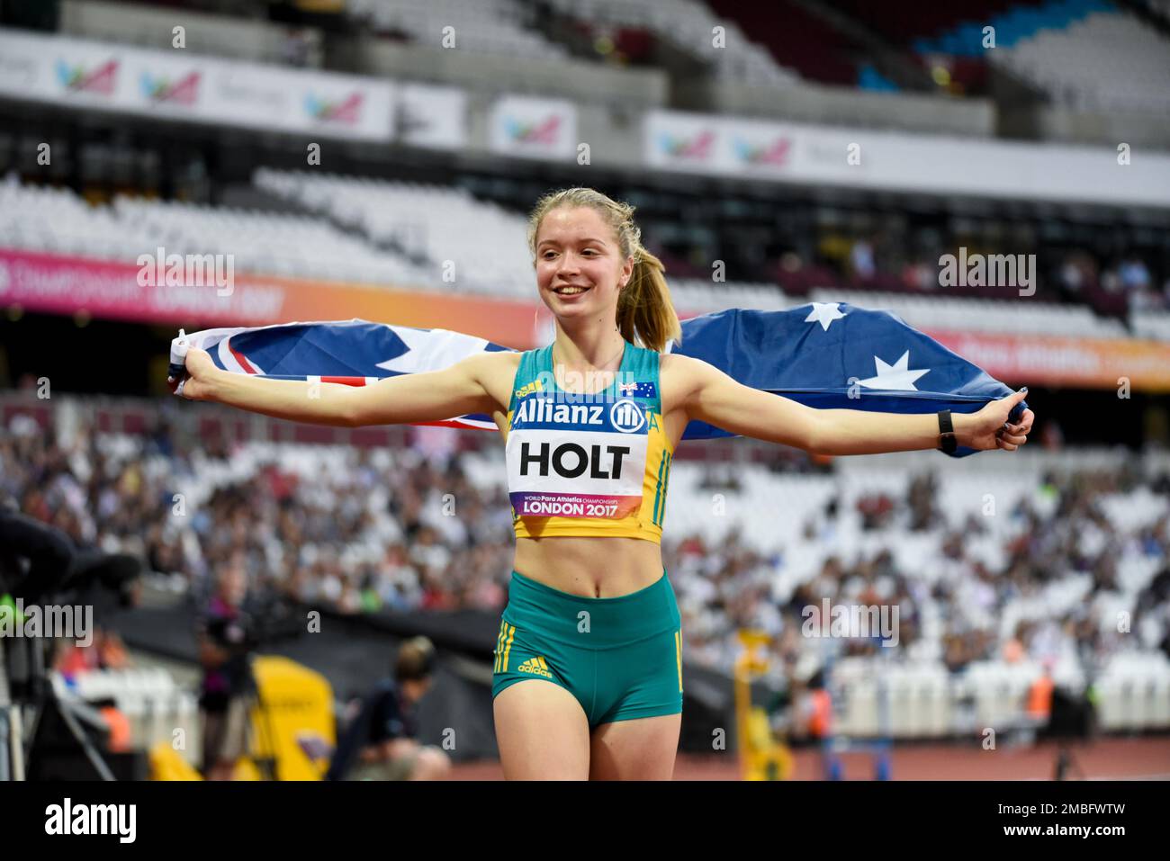 Isis Holt celebrating after winning the 100m T35 in record time in the ...