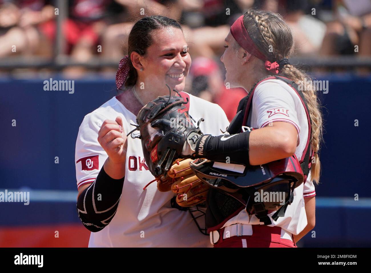 Oklahoma's Hope Trautwein, left, celebrates with catcher Kinzie Hansen ...