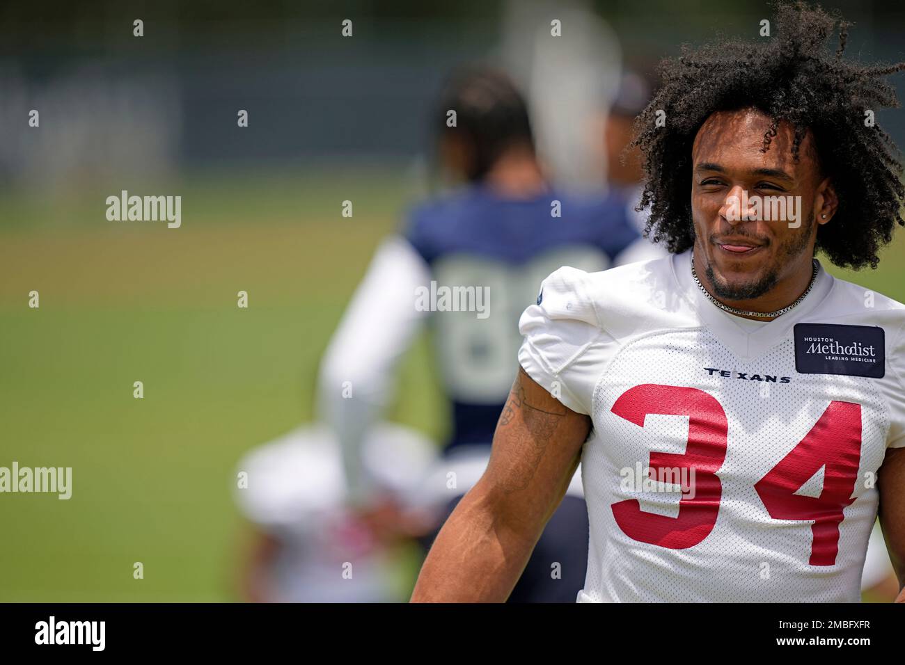 Houston Texans' Dameon Pierce stretches during an NFL football rookie ...