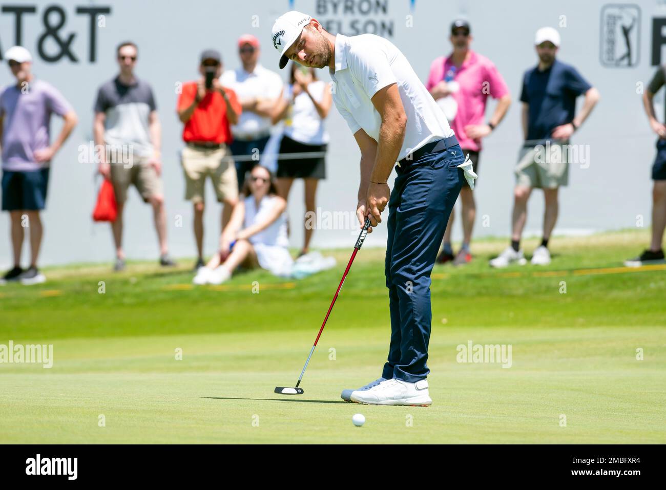 Adam Svensson, of Canada, putts on the 17th hole during the second ...
