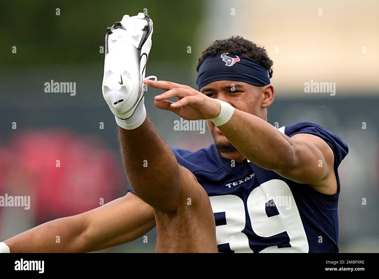 Johnny Johnson III stretches during a Houston Texans NFL football ...