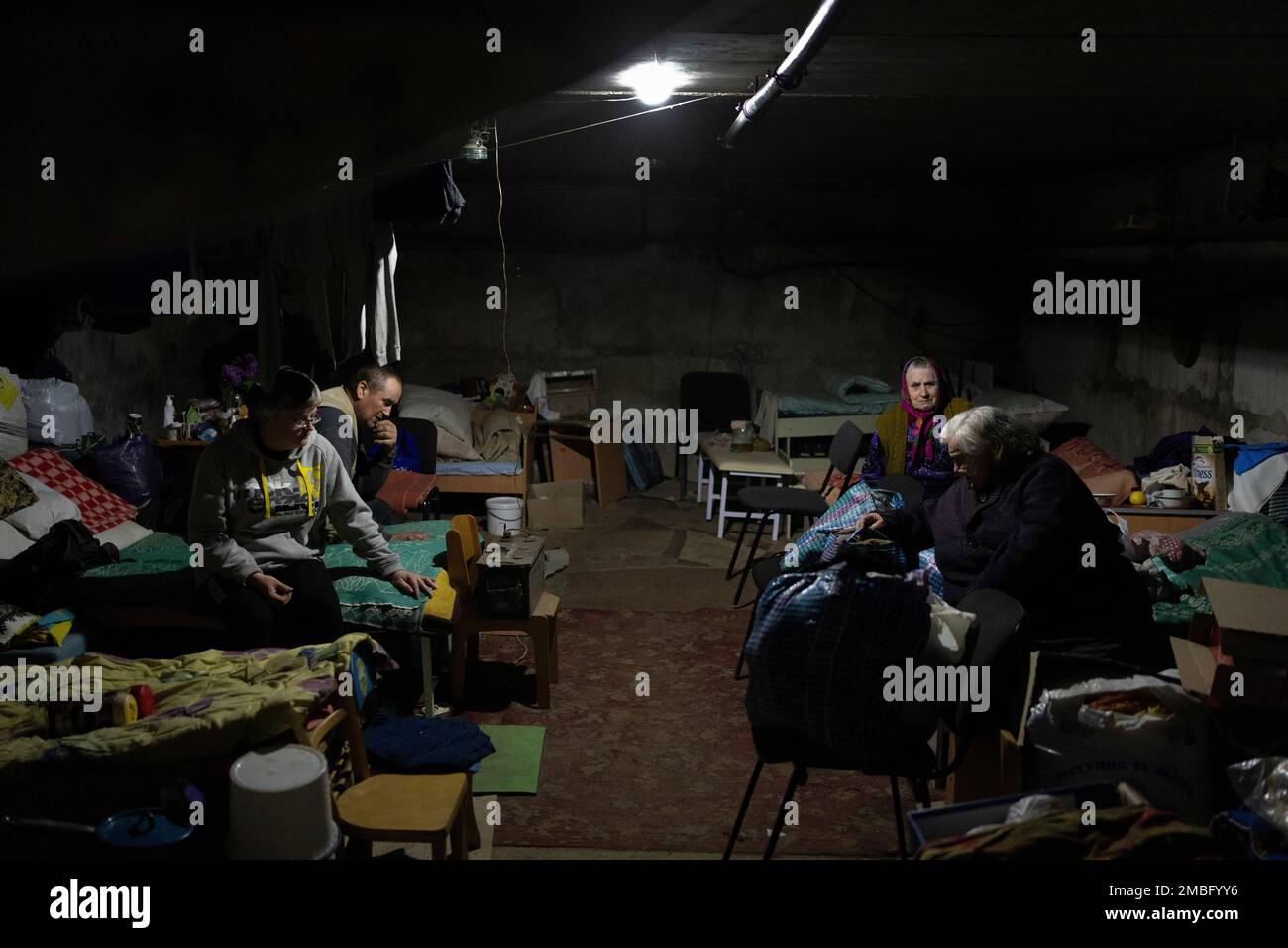 Ukrainian stay inside a basement used as an improvised bomb shelter in ...