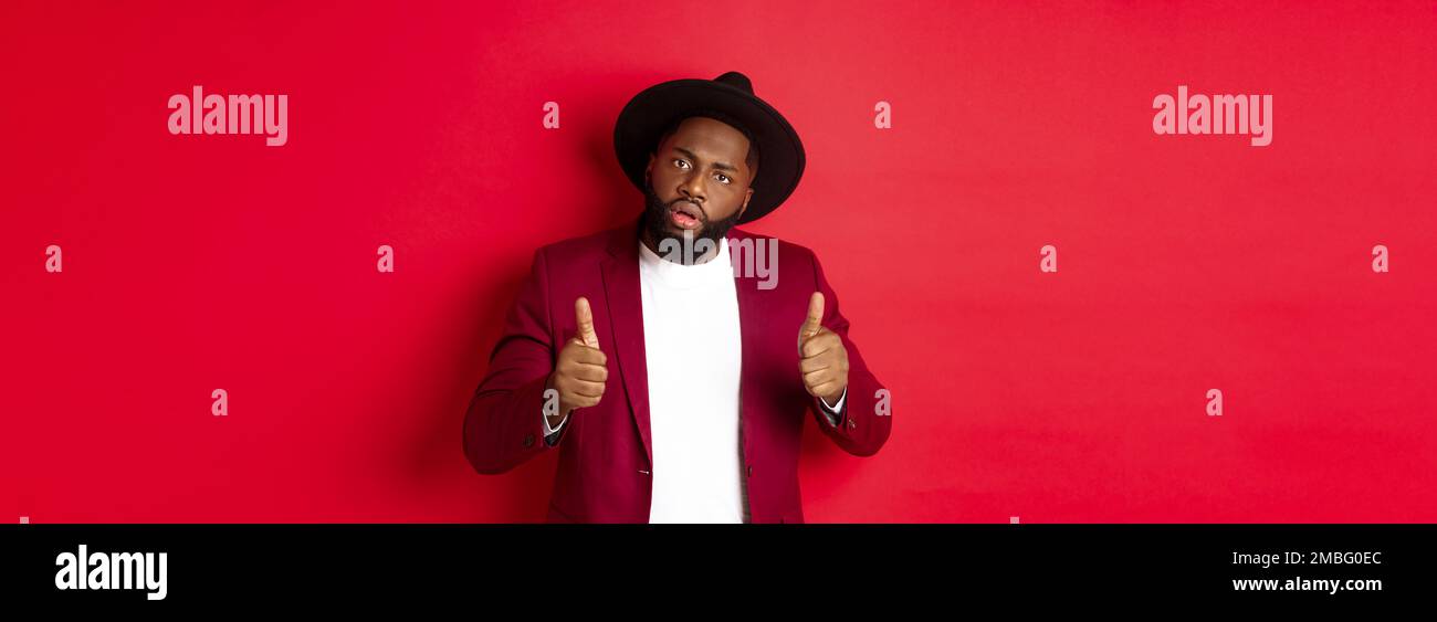 Impressed Black man saying good job, cheer up with thumbs-up, praise ...