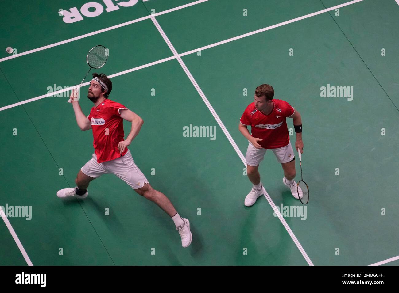 Denmark's Kim Astrup, and Mathias Christiansen return a shot to India's ...