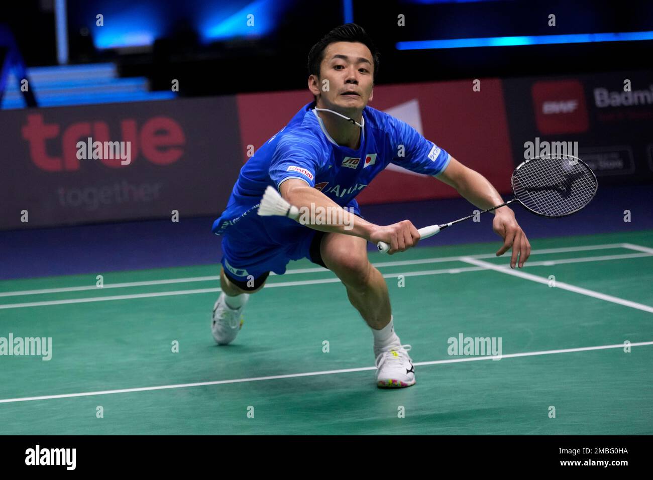 Japan's Kenta Nishimoto return the shot to Indonesia's Jonatan Christie during their men's ...