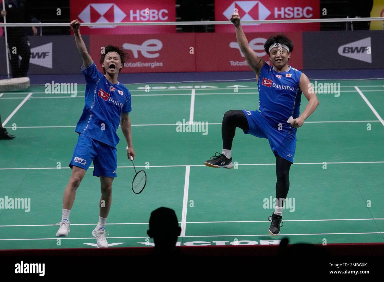 Japan's Yuta Watanabe, left, and Akira Koga react after defeating Indonesia's Fajar Alfian ...