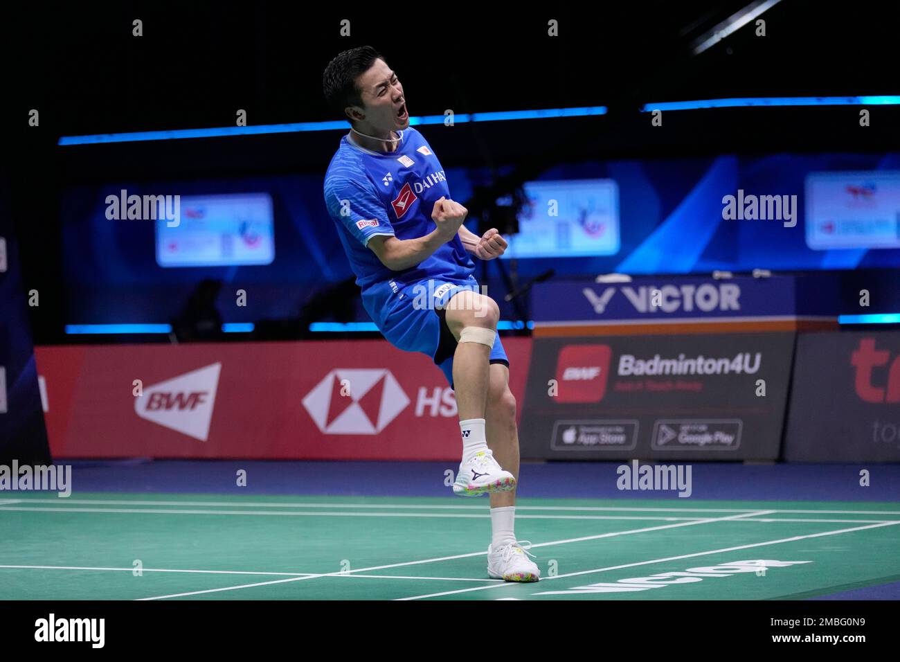 Japan's Kenta Nishimoto reacts after defeating Indonesia's Jonatan Christie during their men's ...