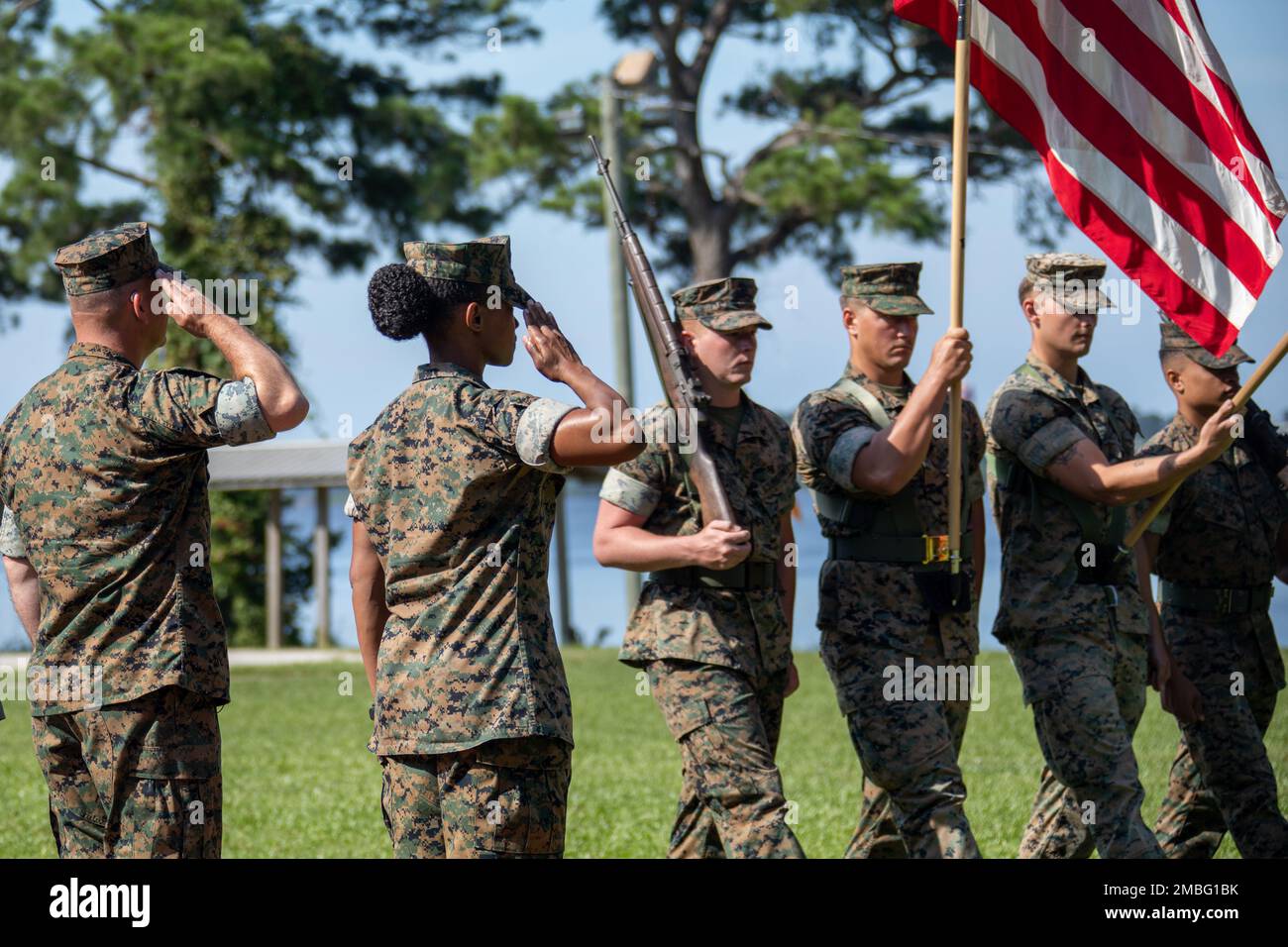 U.S. Marine Corps Col. Eric J. Adams, left, outgoing Commanding Officer, Marine Corps Combat ...
