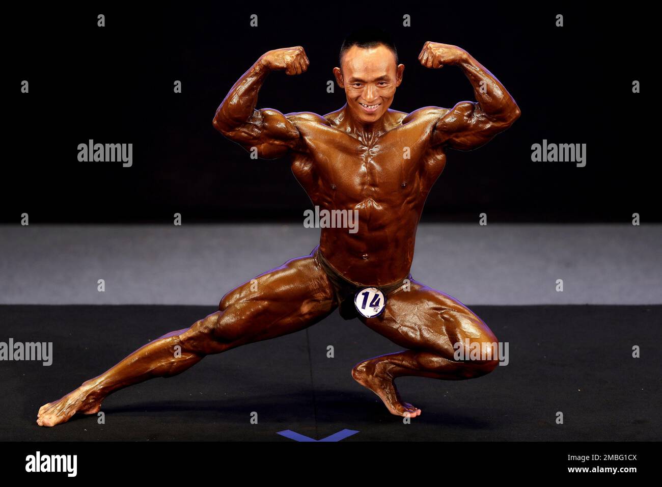 Pham Van Phuoc of Vietnam compete in Men's Bodybuilding 60kg during the 31st Southeast Asian ...