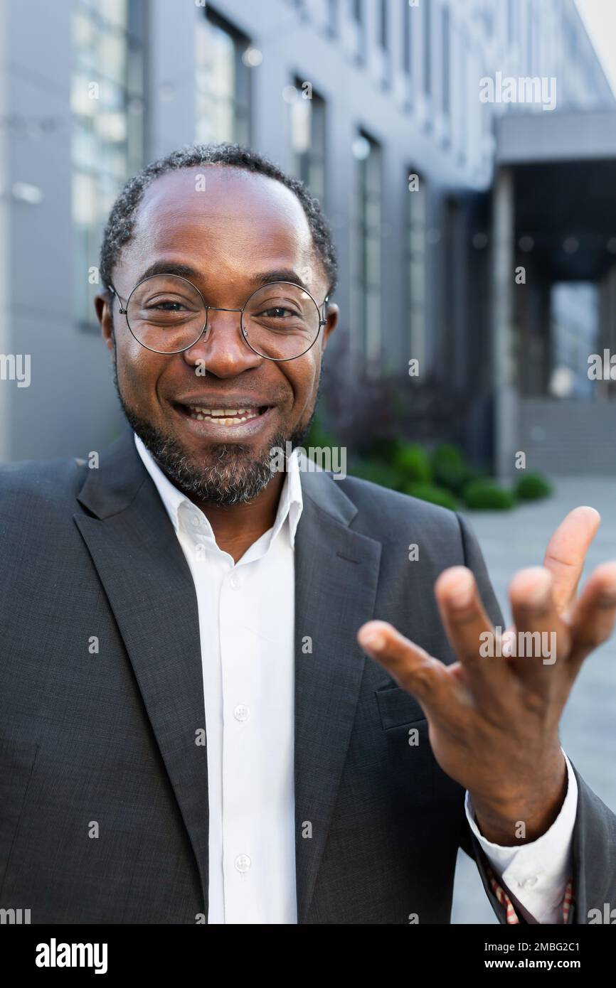 Vertical shot, video call of successful businessman boss, African ...