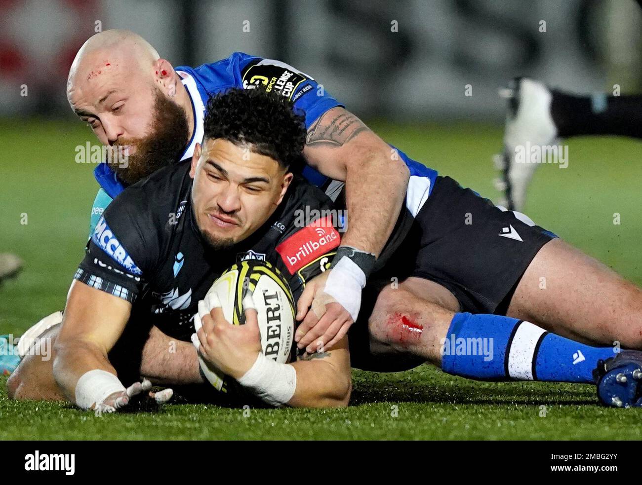 Glasgow Warriors’ Sione Tuipulotu is tackled by Bath Rugby’s Tom Dunn ...