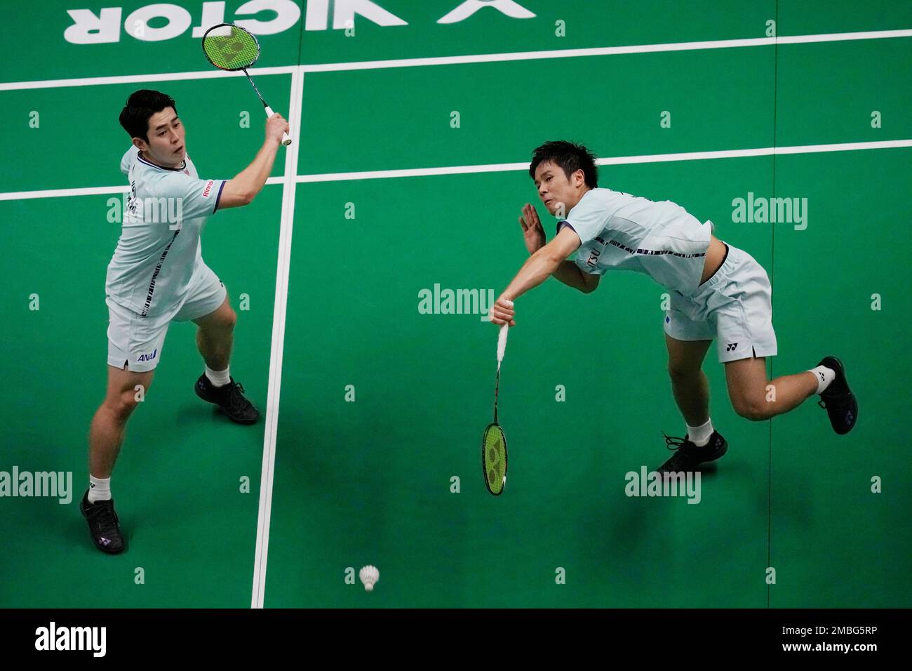 Japan's Yugo Kobayashi, right, with Takuro Hoki, returns the shot to ...