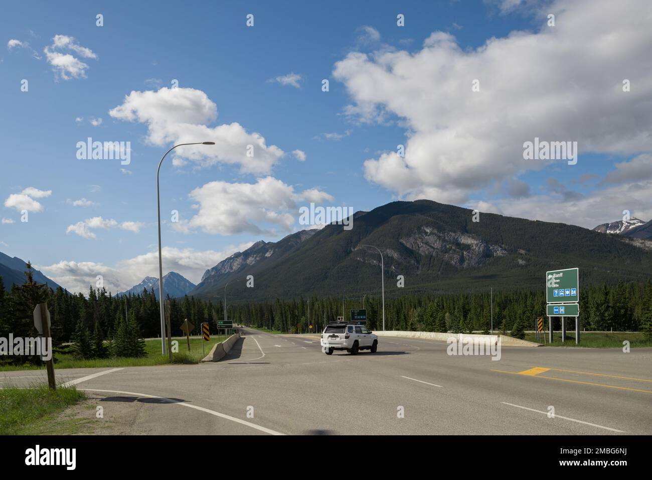 Highway in mountains Trans Canada Highway with a perfect asphalt at sunrise in summer. in Banff ...