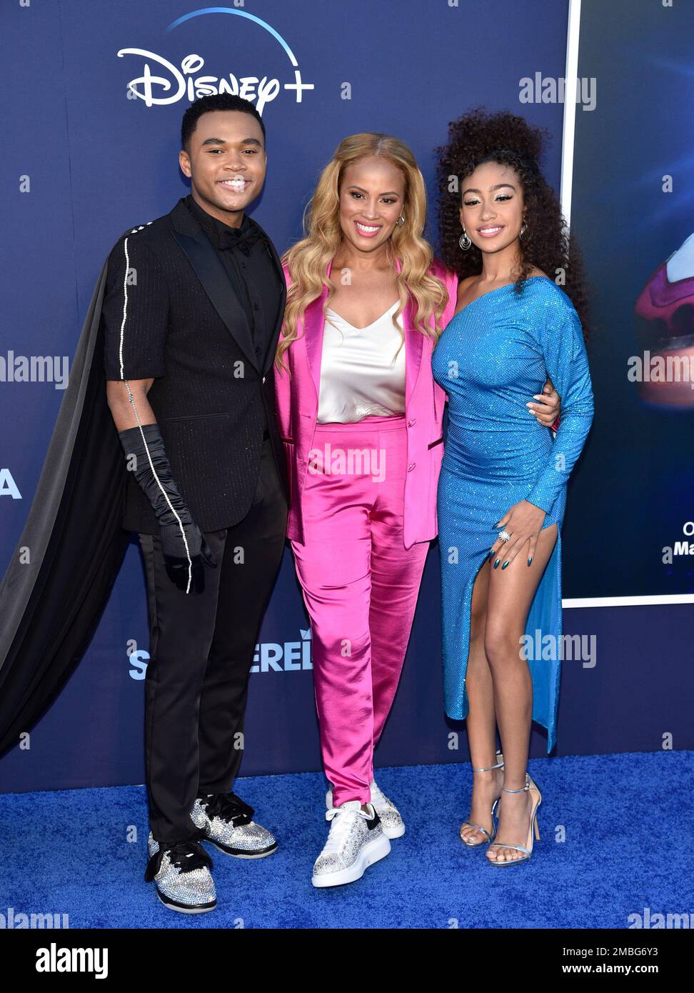 Disney branded television president Ayo Davis, center, poses with ...