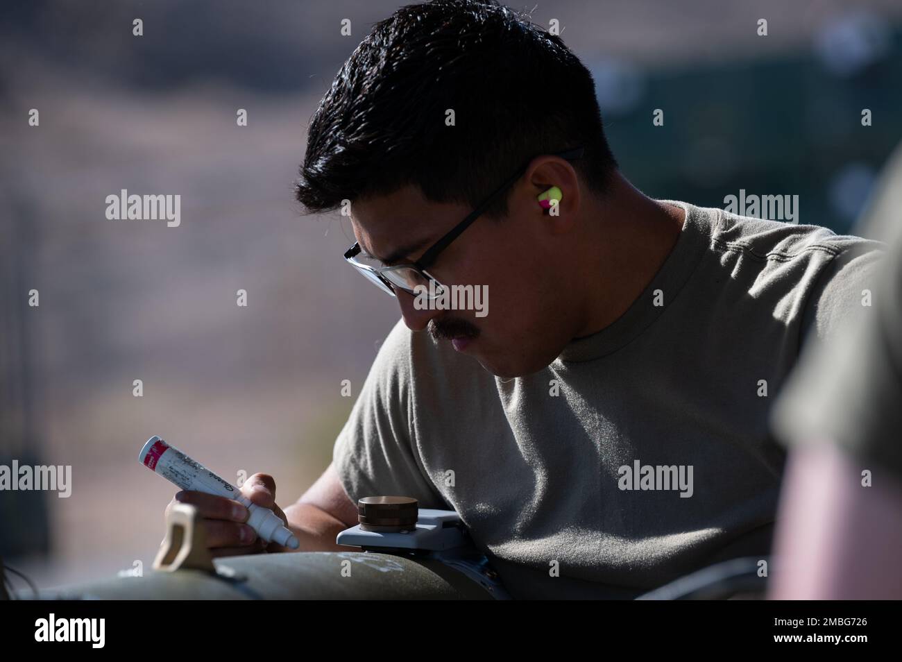 A Munitions Systems specialist participates in Iron Flag-Nellis 22-2 ...