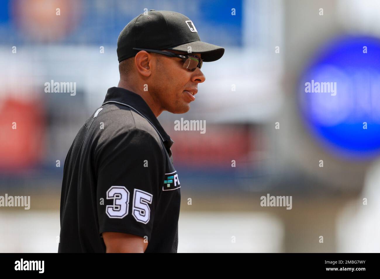 MLB umpire Jeremie Rehak stands on the field during a baseball game ...