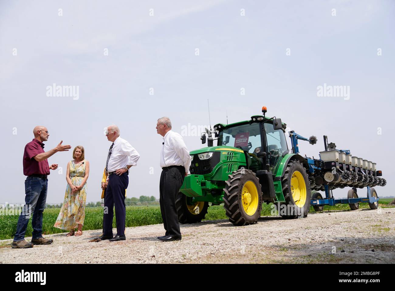President Joe Biden listens as O'Connor Farms owner Jeff O'Connor, left ...