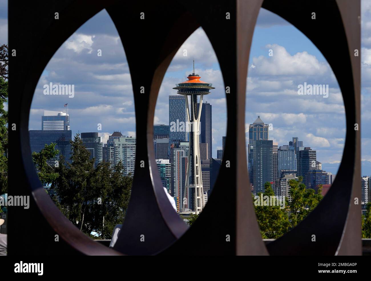 The Space Needle is framed through the steel sculpture "Changing Form ...