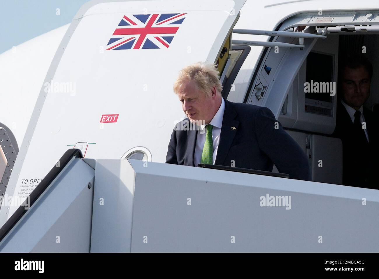 British Prime Minister Boris Johnson gets off the plane after landing ...