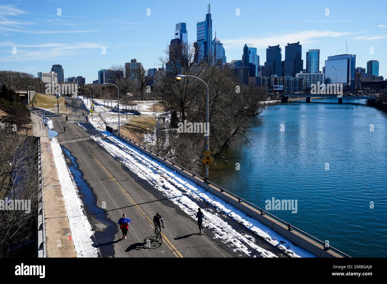 People exercise along Dr. Martin Luther King Junior Drive in view of ...