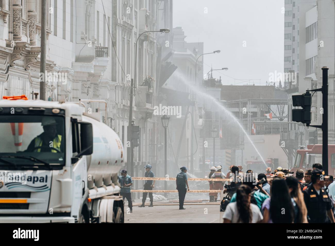 Lima, Peru - January 20 2023: Firefighters trying to control historical ...