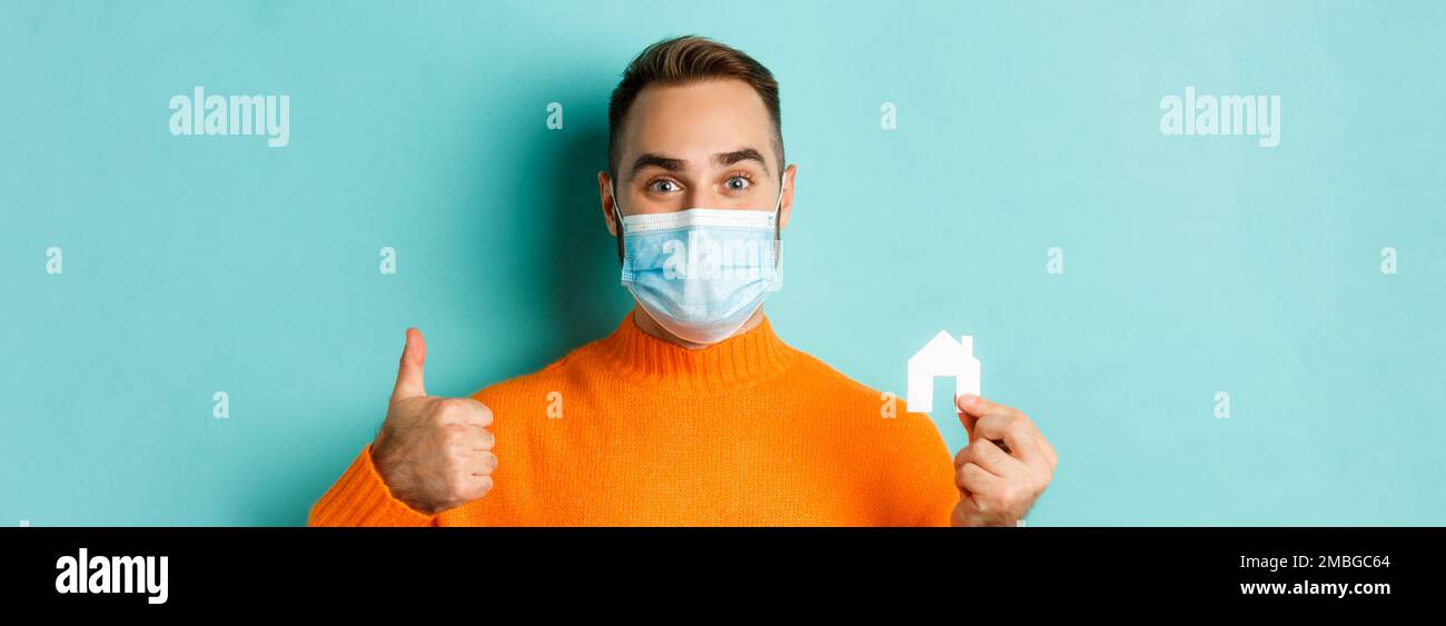 Real estate and coronavirus pandemic concept. Close-up of adult man in ...