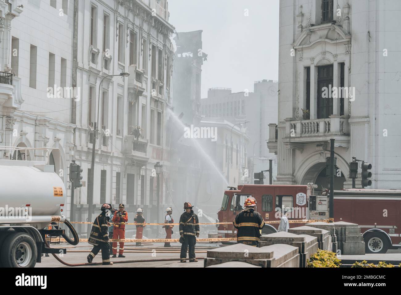 Lima, Peru - January 20 2023: Firefighters trying to control historical ...