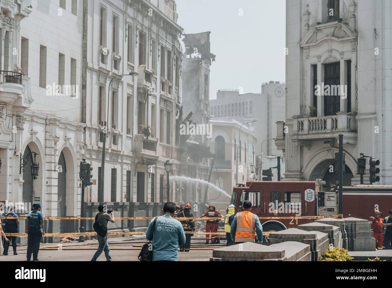 Lima, Peru - January 20 2023: Firefighters trying to control historical ...