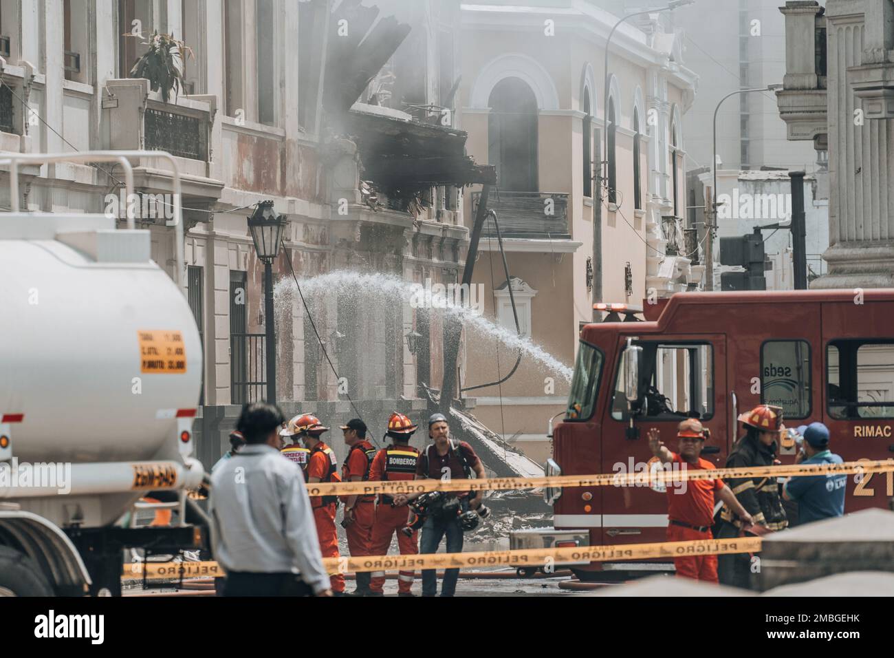 Lima, Peru - January 20 2023: Firefighters trying to control historical ...