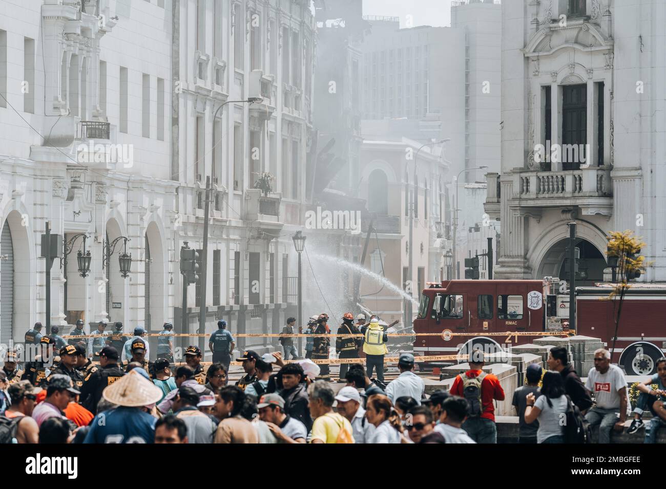 Lima, Peru - January 20 2023: Firefighters trying to control historical ...