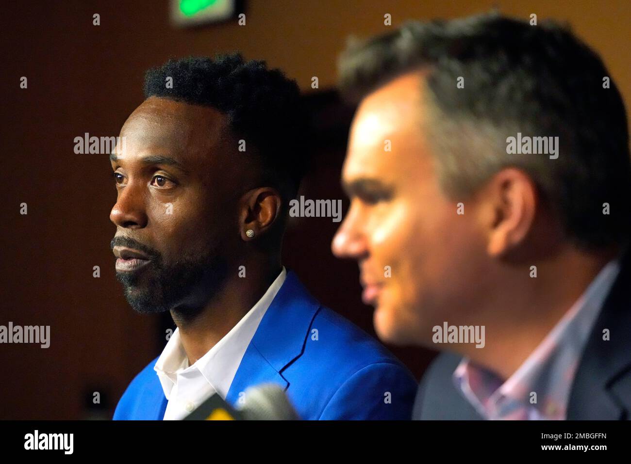 Pittsburgh Pirates' Andrew McCutchen, left, listens as he is introduced ...
