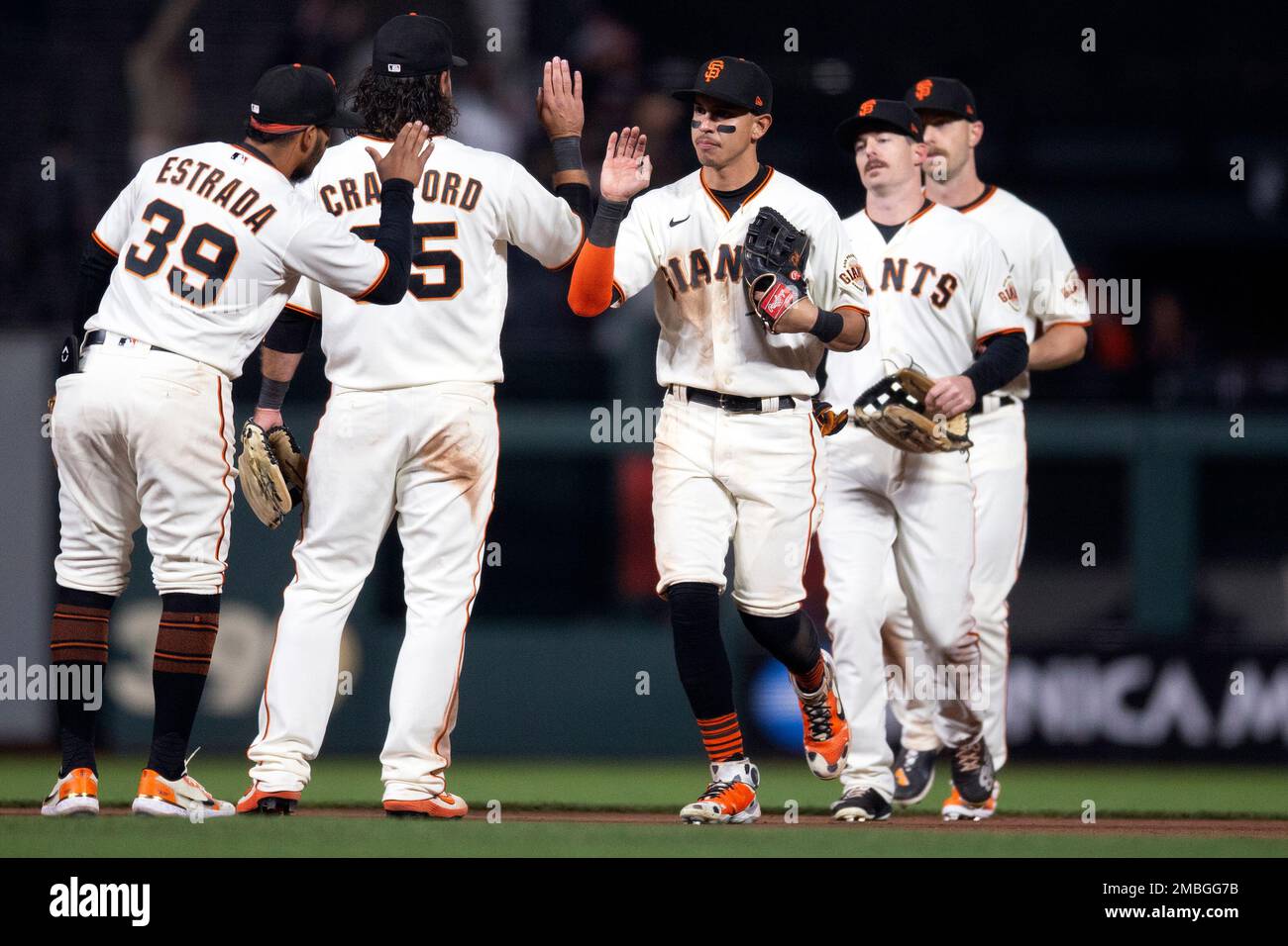 San Francisco Giants players celebrate their 8-5 victory over the ...