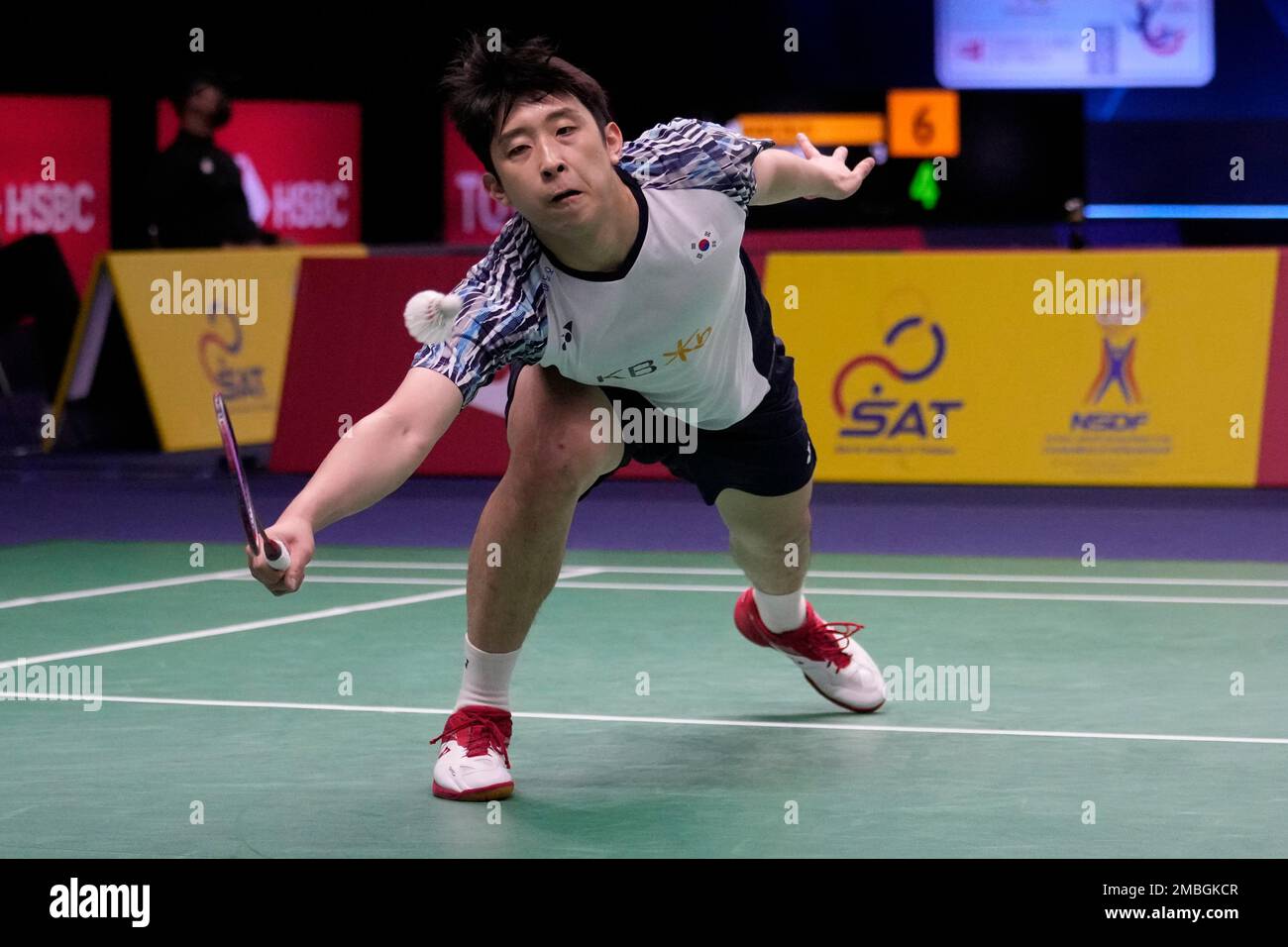 South Korea's Heo Kwanghee returns a shot to Singapore's Kean Yew Loh ...