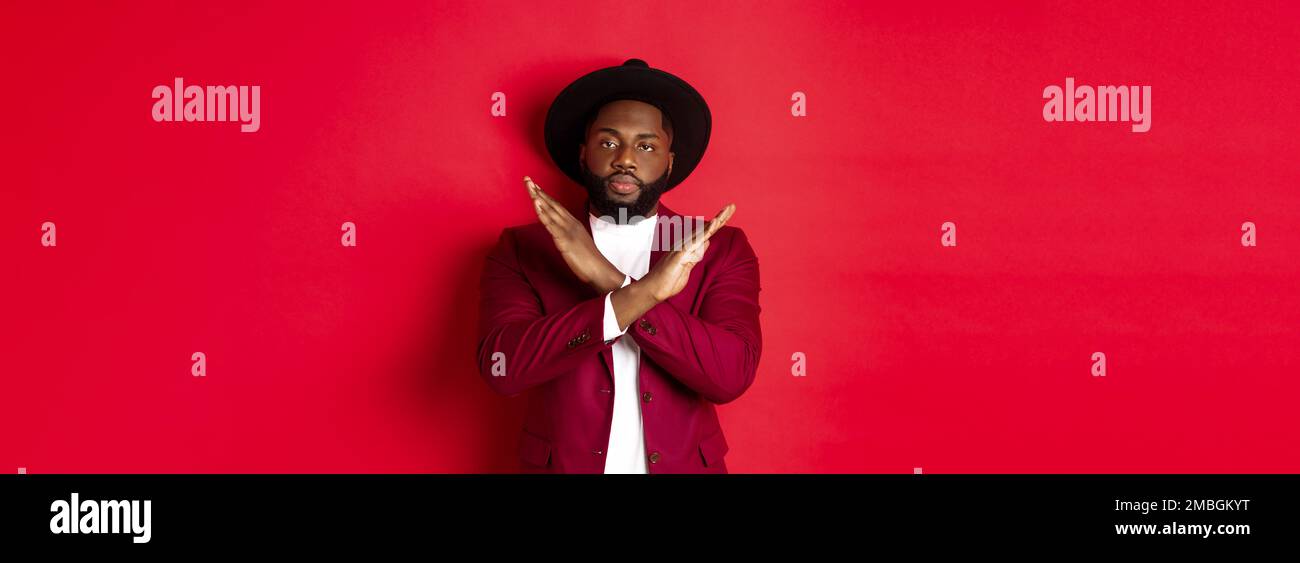 Image of serious Black man strongly disagree, showing cross sign to ...
