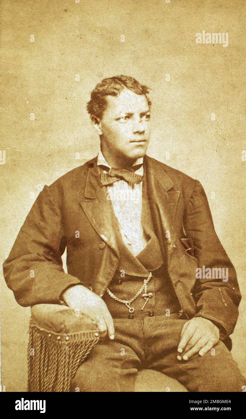 Seated young man resting arm hi-res stock photography and images - Alamy