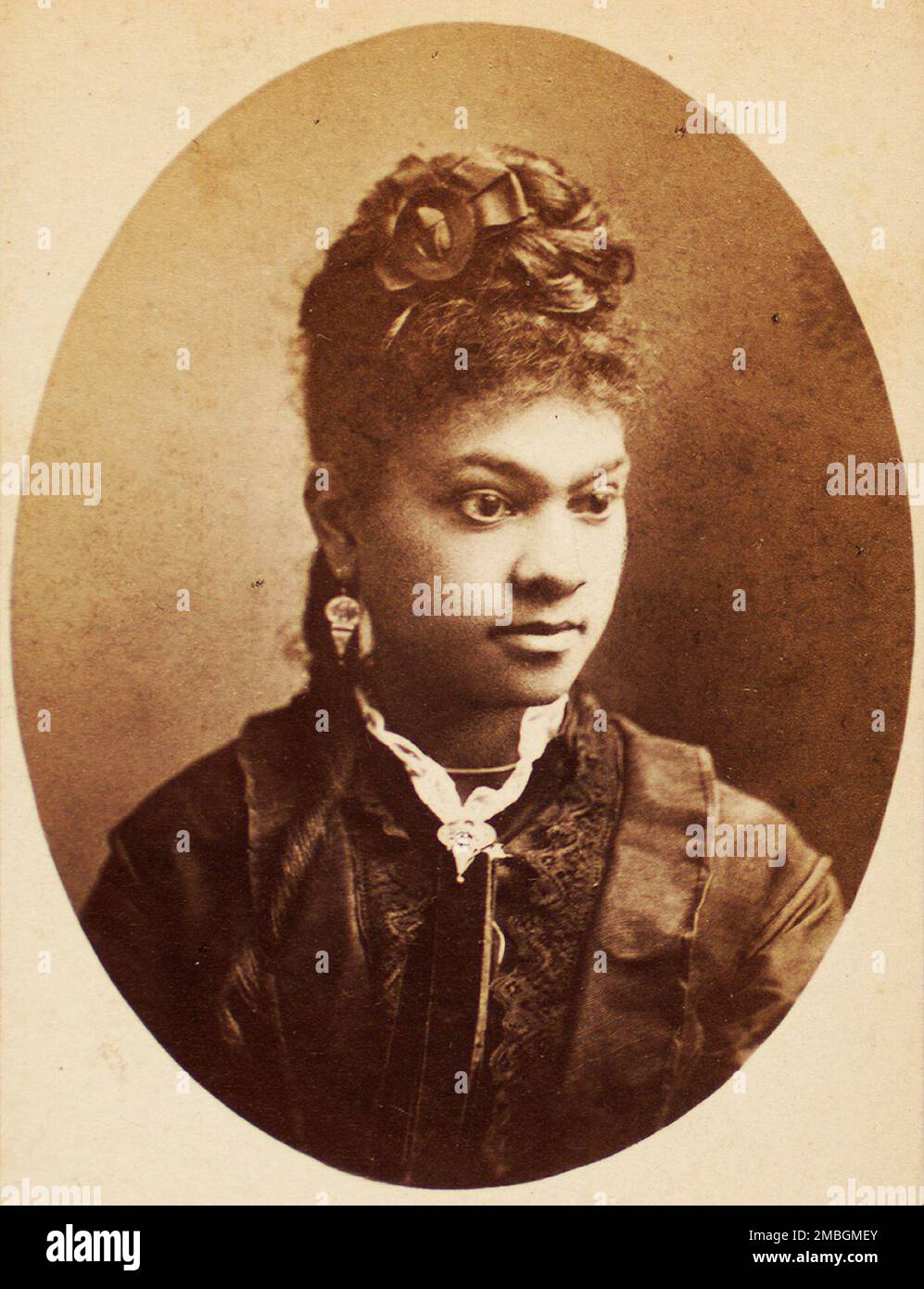 Oval quarter-length portrait of unidentified young woman, her bodice ...