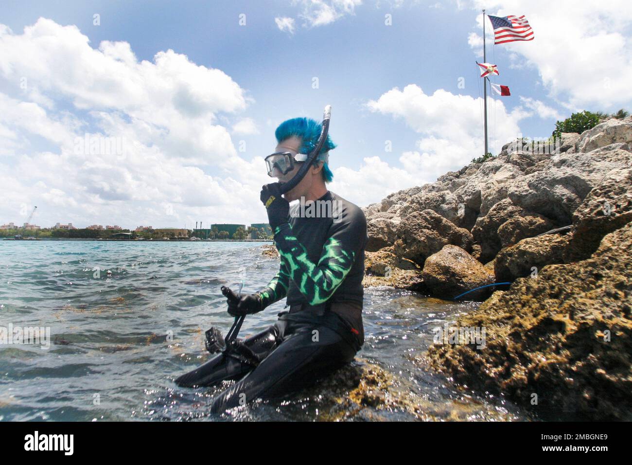Marine biologist Colin Foord prepares to snorkel along a rock wall ...