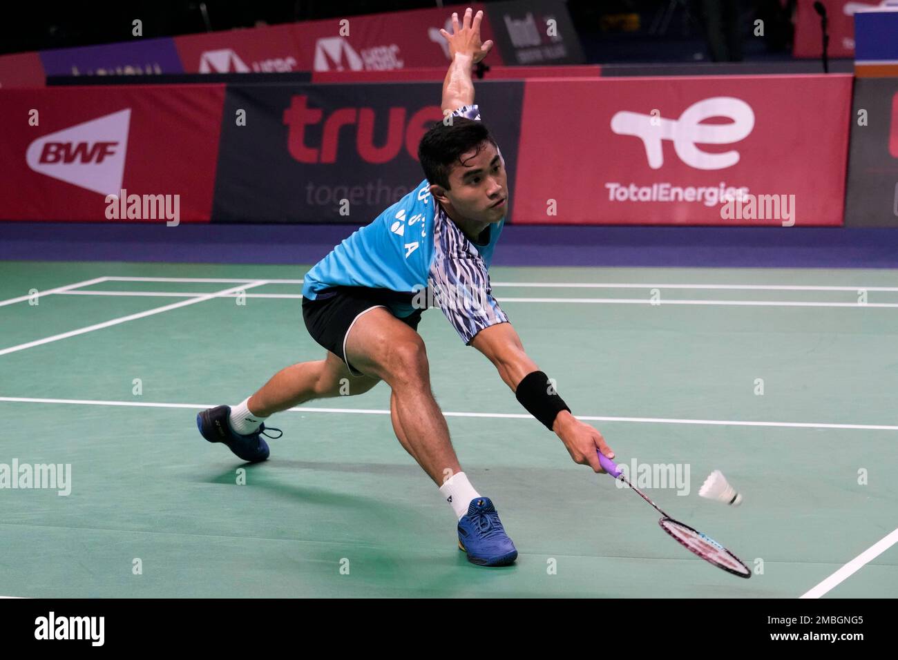 Enrico Asuncion of the U.S. returns a shot to Kenta Nishimoto of Japan ...