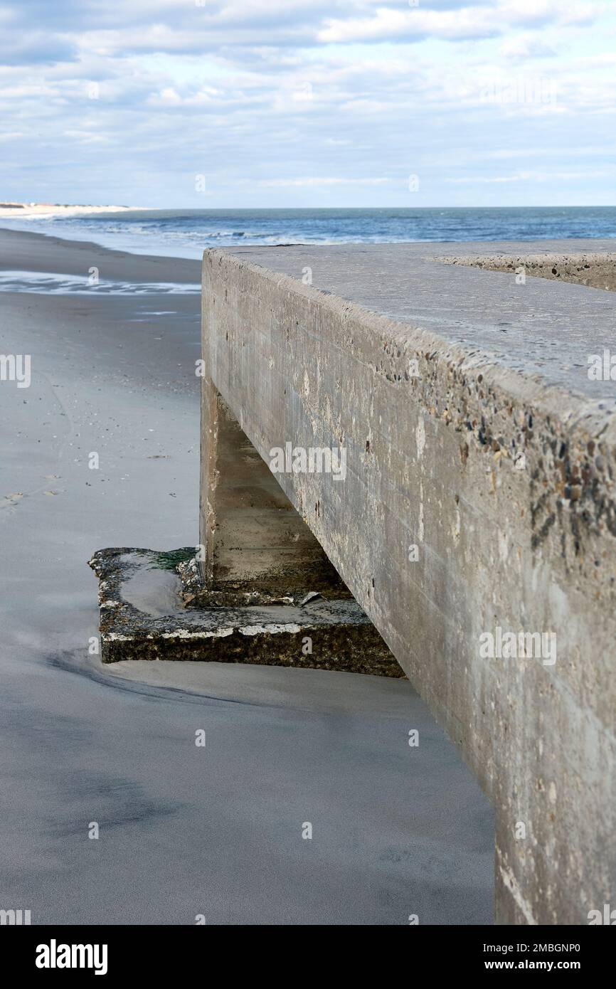 An abandoned concrete structure on the beach at Indian River Inlet ...
