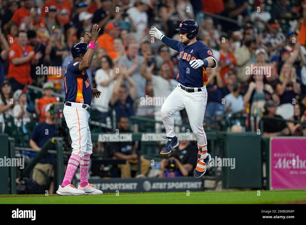 Houston Astros' Alex Bregman, right, celebrates with third base coach ...