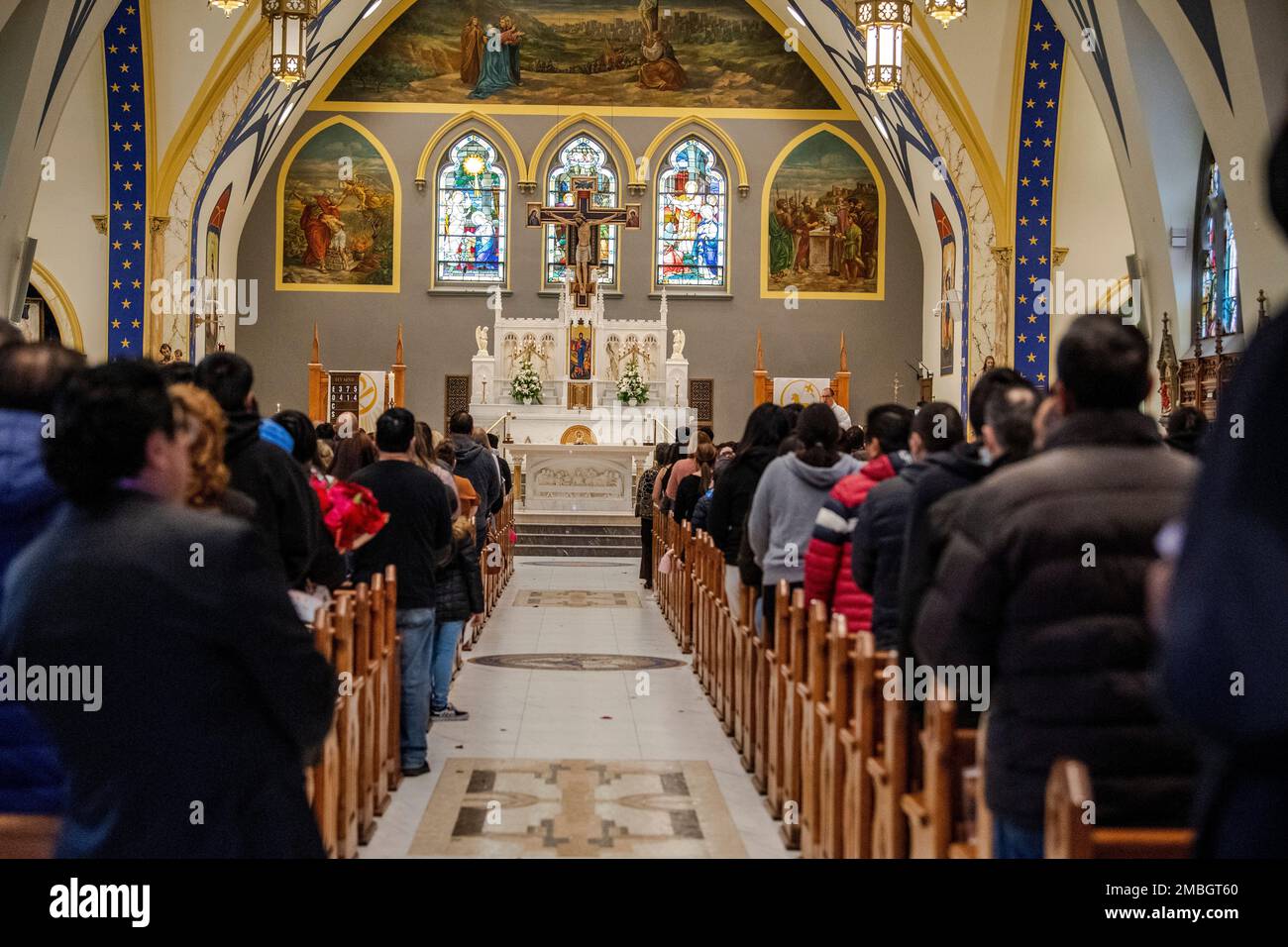 Church goers listen to Rev. Manuel Rodriguez preside mass at Our Lady ...