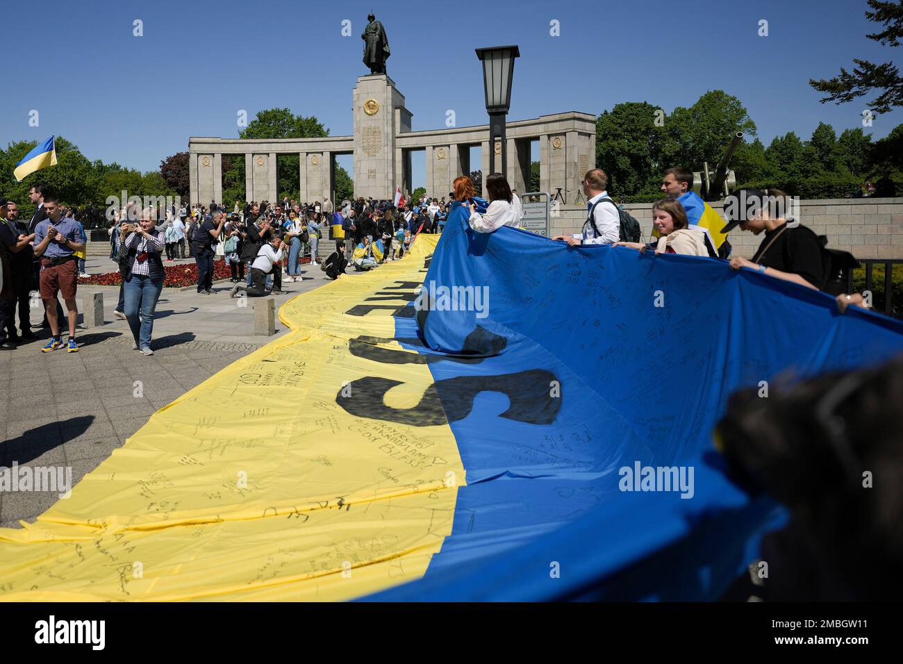 People display a huge Ukrainian nationl flag at the Soviet War Memorial ...