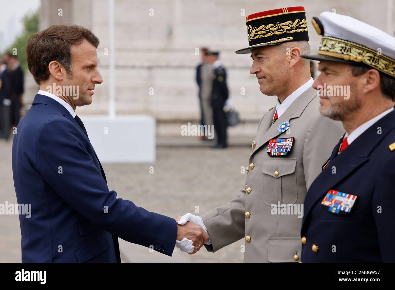 Emmanuel Macron, left, shakes hands with French Army chief of staff ...